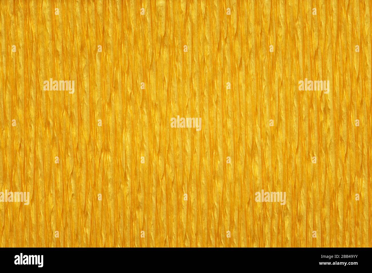 Yellow wrinkled crepe paper vertical close-up detail. Front view Stock ...