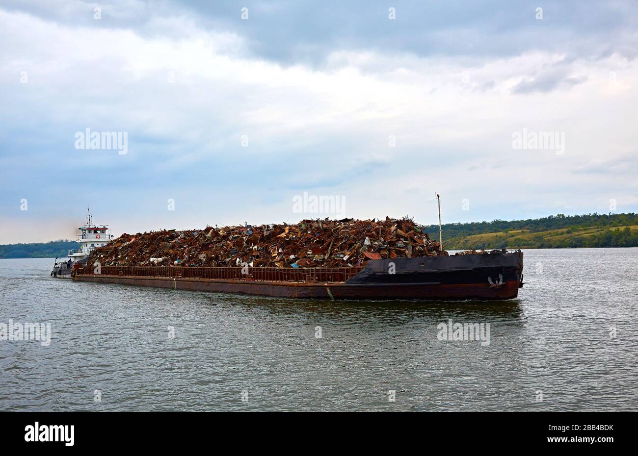 Scrap metal on a barge on a river in Germany Stock Photo - Alamy