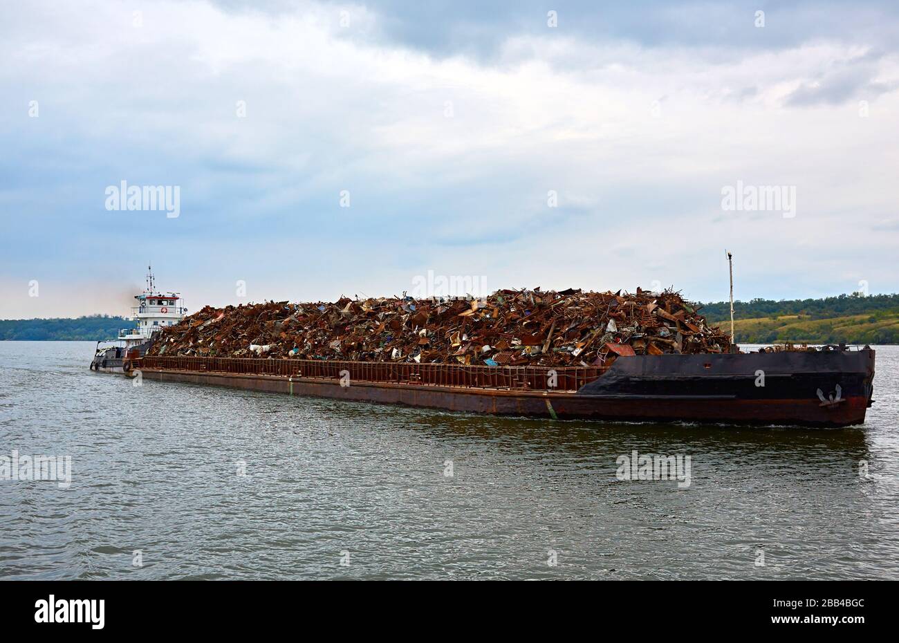 Scrap metal on a barge on a river in Germany Stock Photo - Alamy