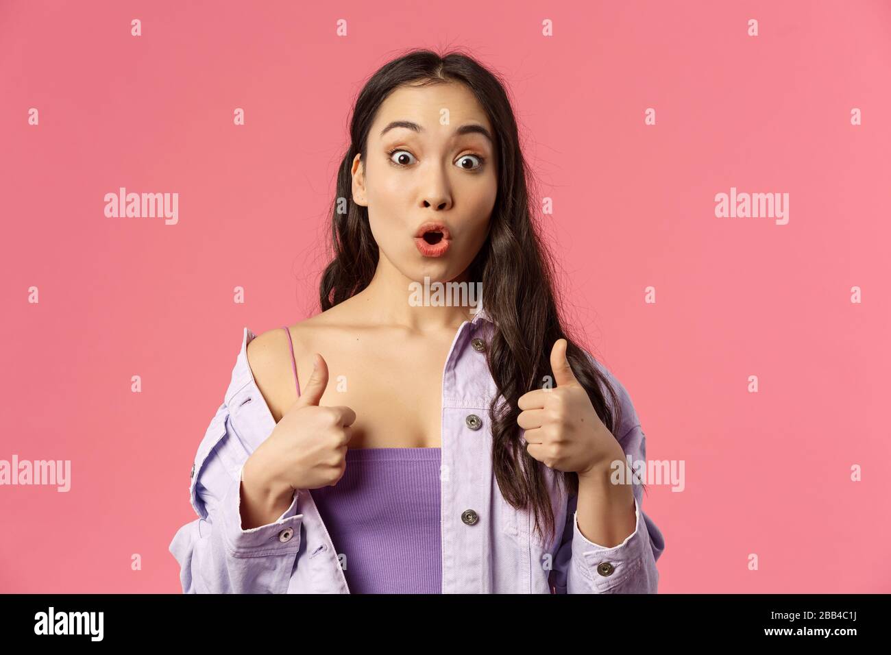 Close Up Portrait Of Excited And Amazed Young Asian Woman Gasping