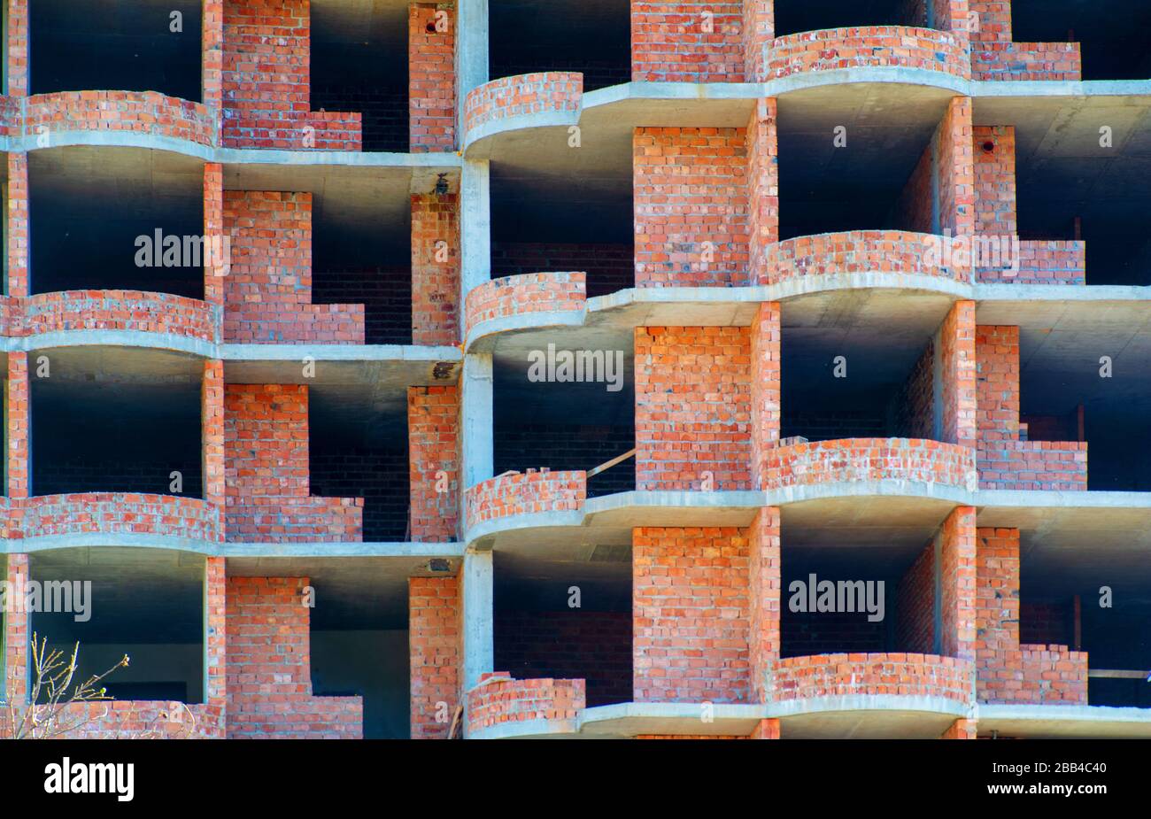 Unfinished brick multi-storey residential building, texture, background ...