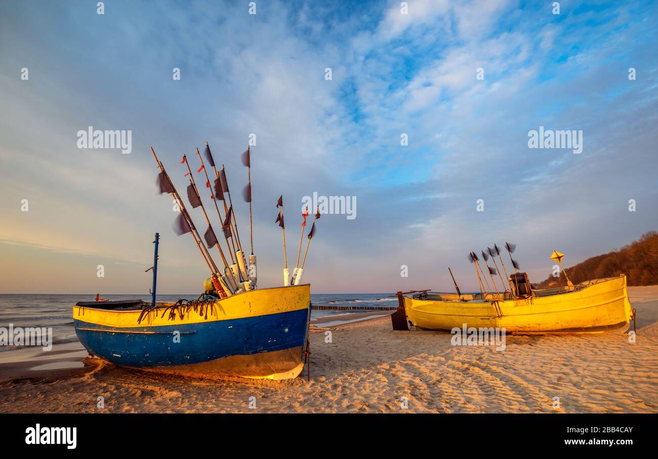 Beautiful sunset on beach boats hi-res stock photography and images - Alamy
