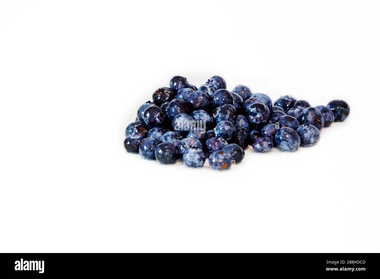 Delicious seasonal fruits, Several loose blueberries, mixed together on ...