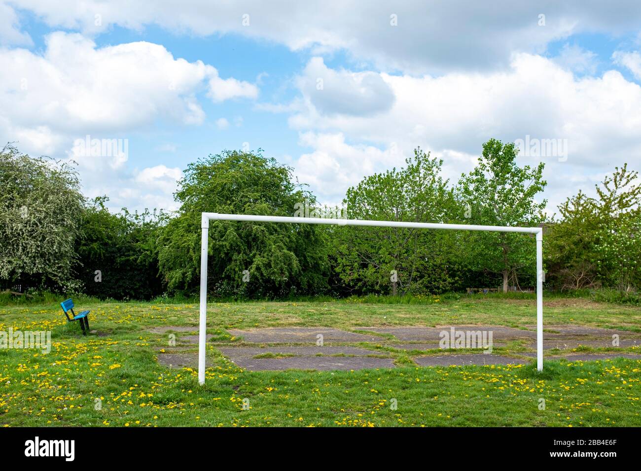Goal post with bench in children's playground with removed equipment in ...