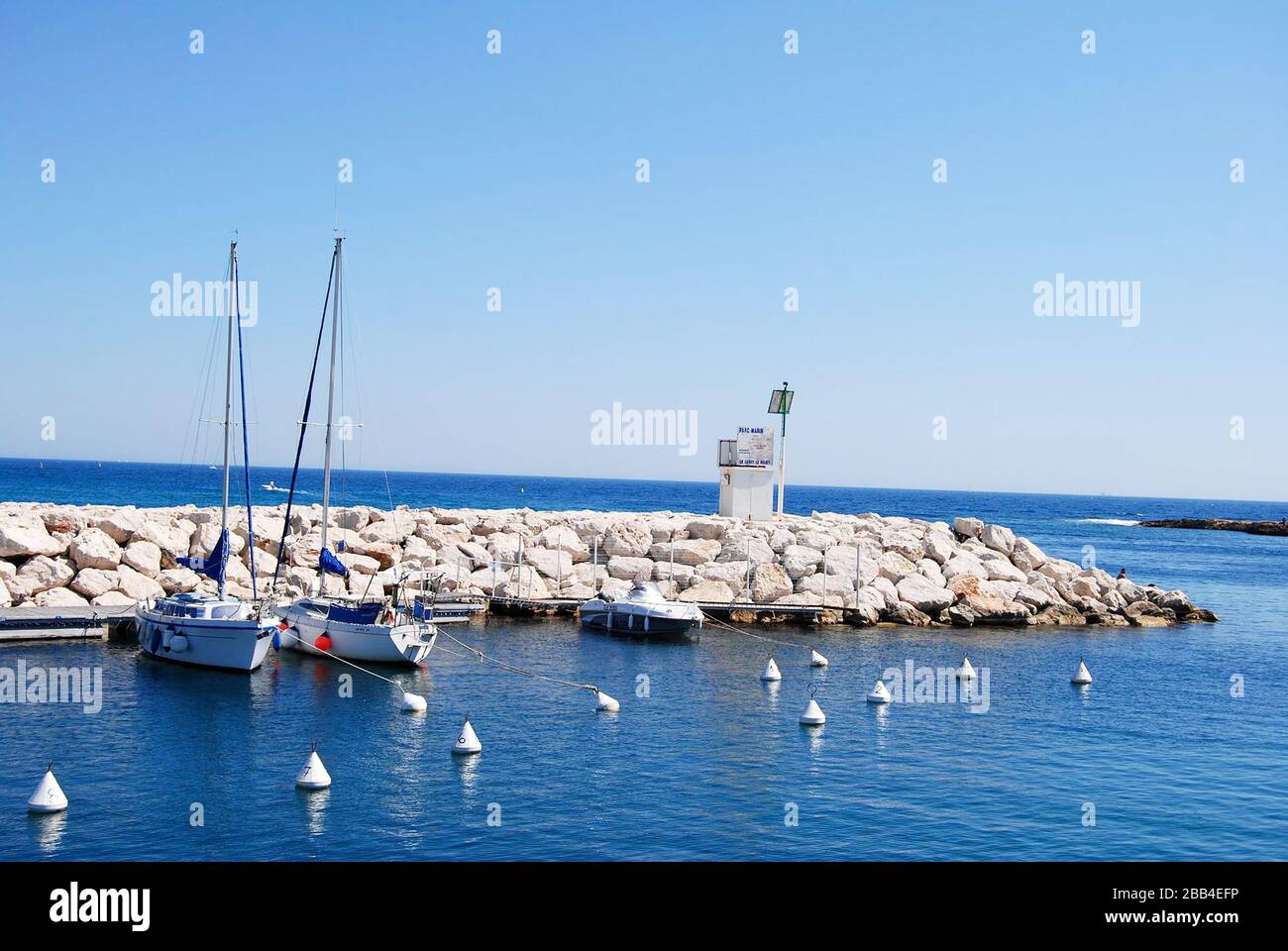 Pretty harbor with boats and view on the sea side and the city in ...