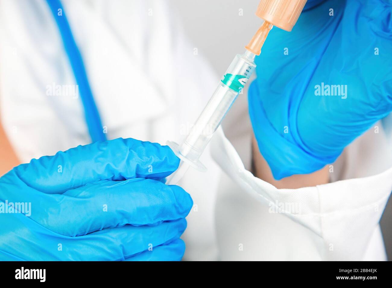 Close-up portrait of a healthcare professional preparing an injection ...