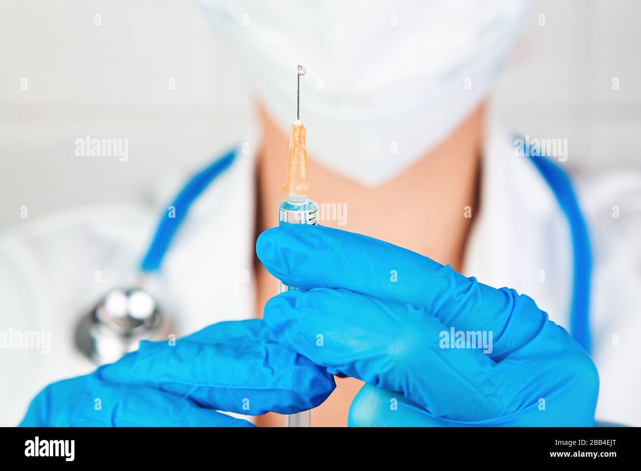 Close-up portrait of a healthcare professional preparing an injection ...