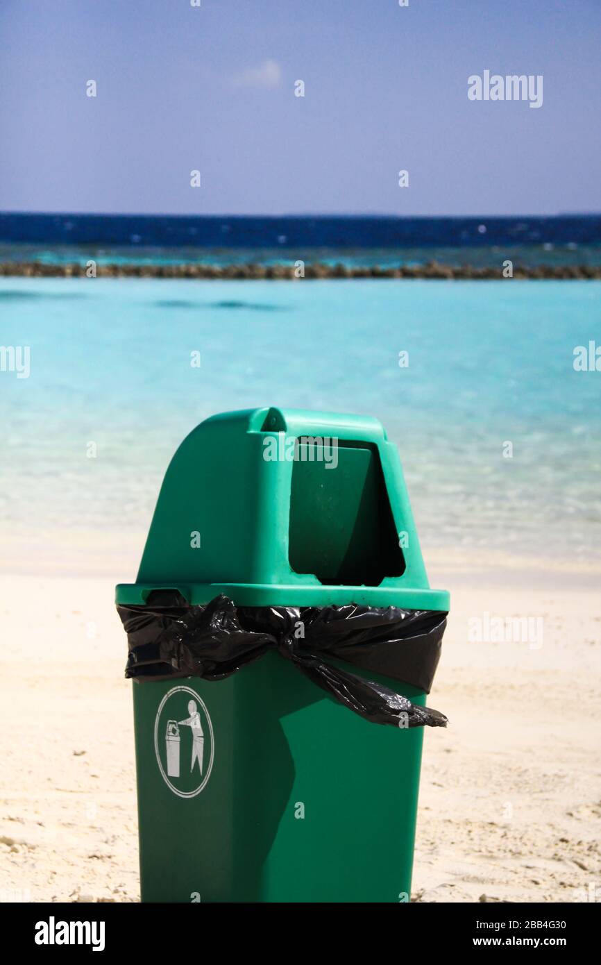 Green Plastic Bin on Clean Sandy Tropical Beach after Recycling Waste ...