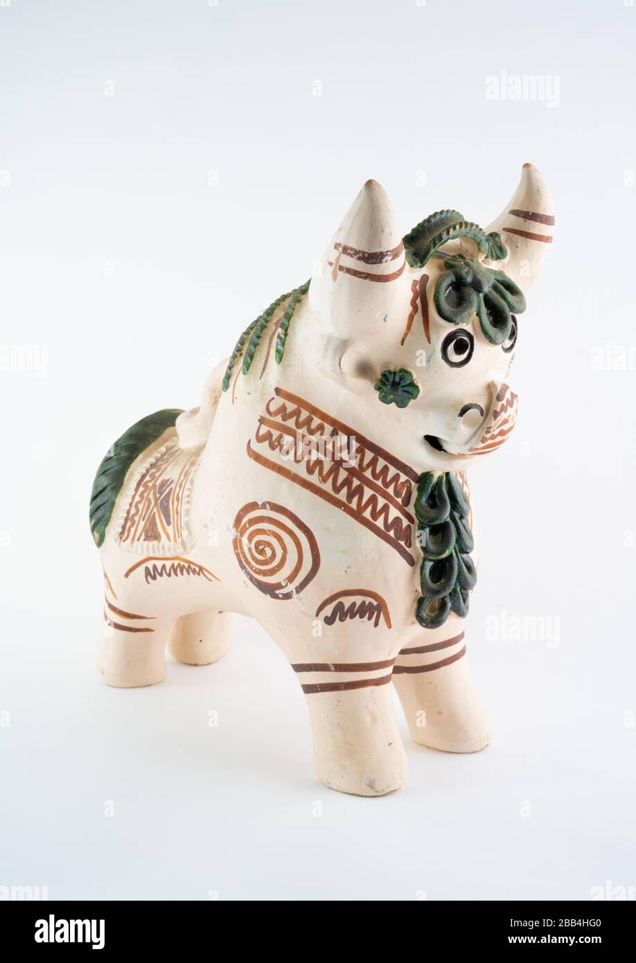 A hand-painted ceramic Chinese bull, traditionally placed in pairs on ...