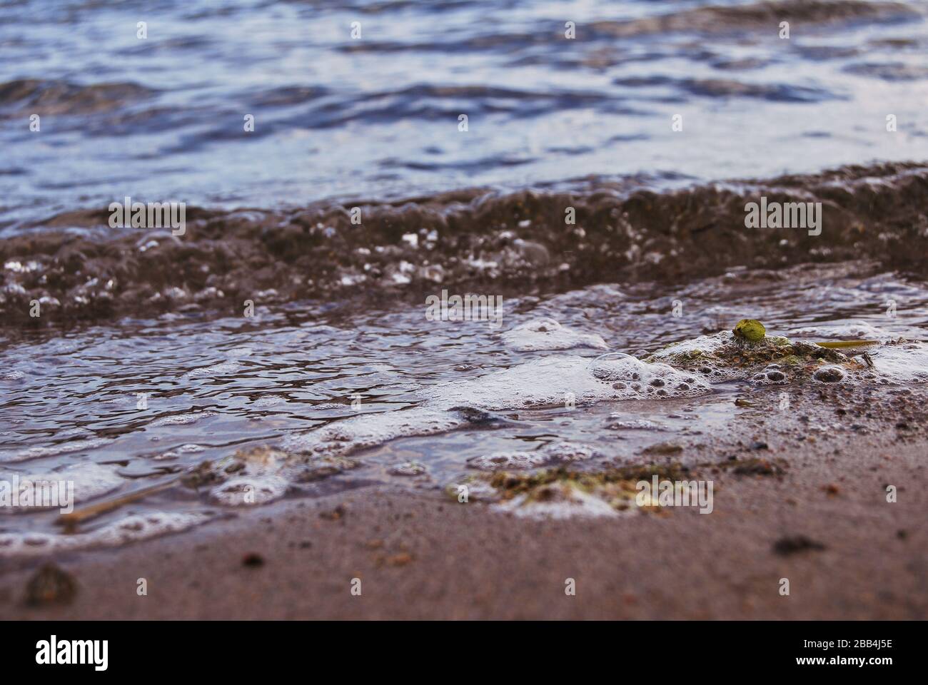 Details of rocks and sand on a Swedish lake with small waves Stock ...
