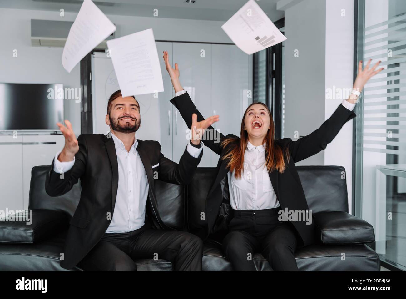 happy colleagues throwing business papers,The celebration of success ...