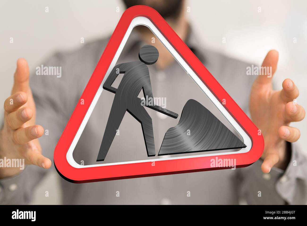 A under process sign in hand Stock Photo - Alamy
