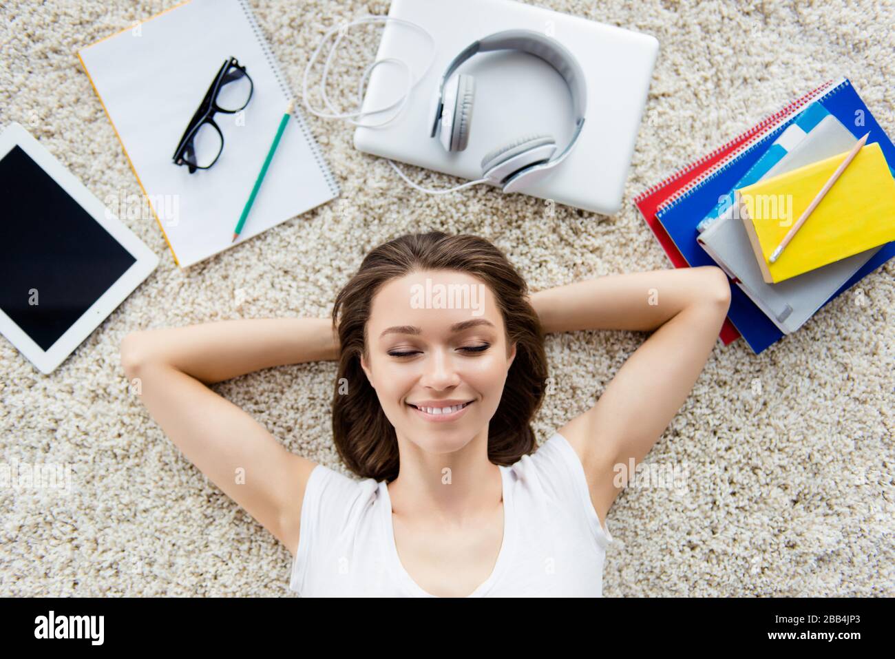 above top view photo of young relaxed student with closed eyes lying on ...
