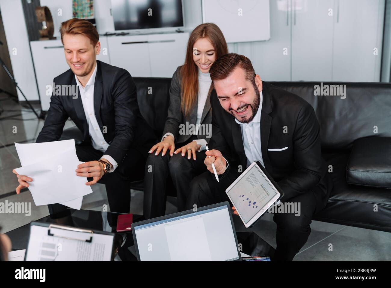 Colleagues discussing issue at business meeting in office Stock Photo ...