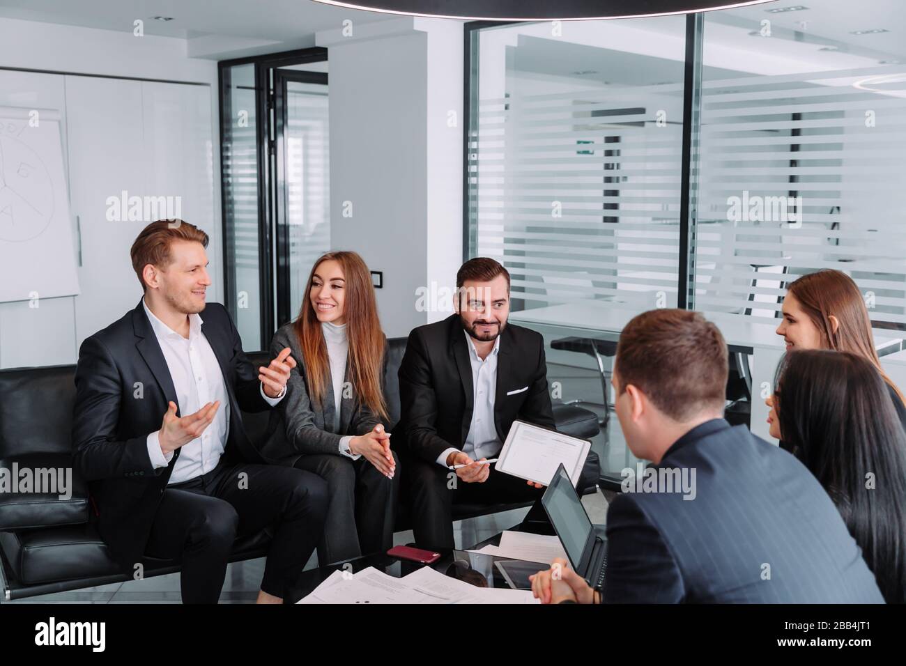 businesspeople discuss financial report in charts diagrams and graphs ...