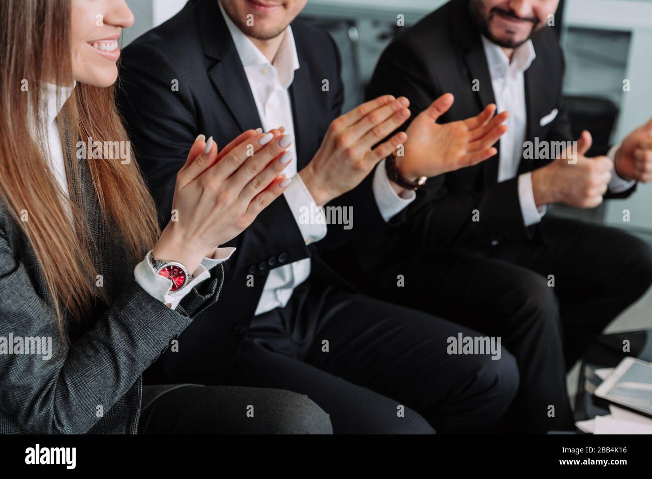 business people at the meeting, applauding and clapping their hands in ...