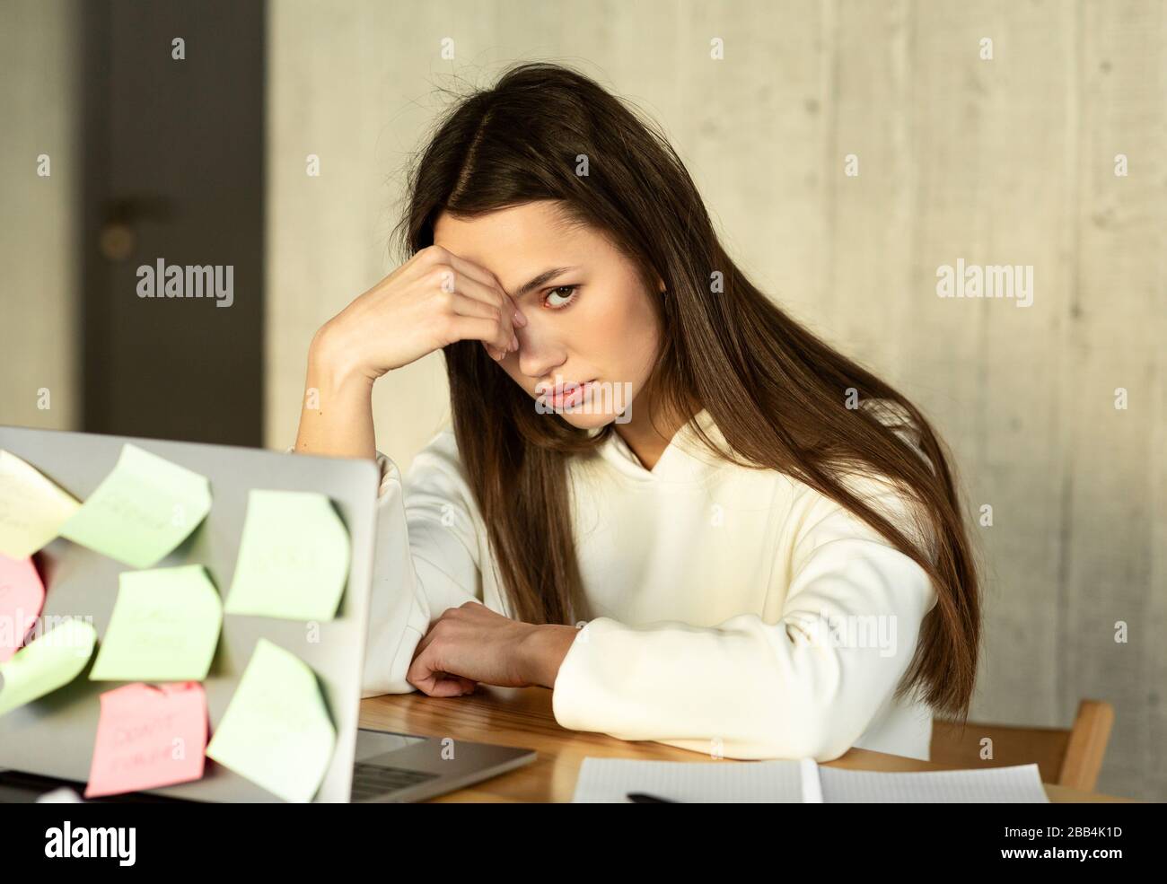 Girl in front of computer with task stickers Stock Photo - Alamy