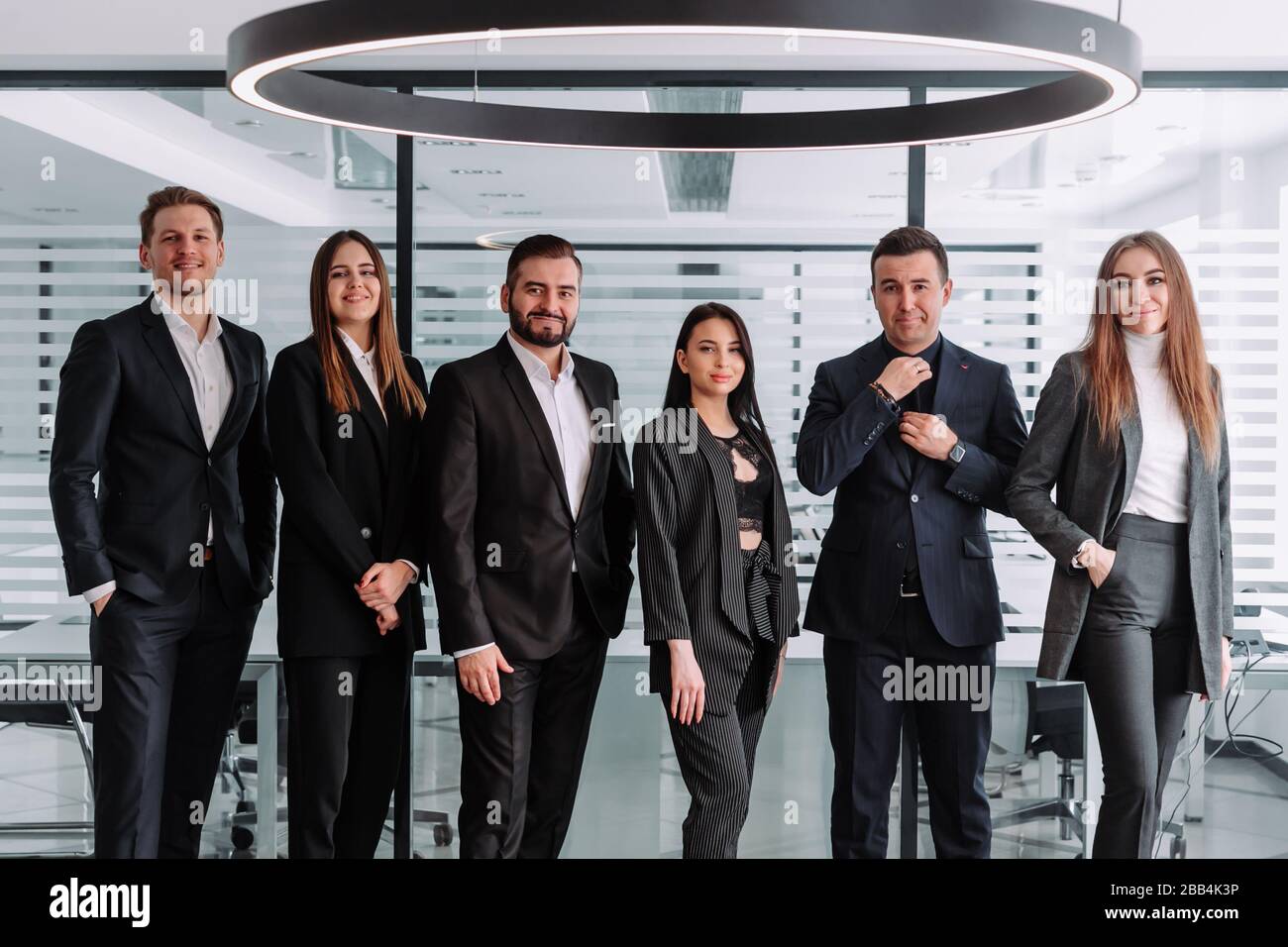 Confident team. Successful colleagues posing at camera Stock Photo - Alamy