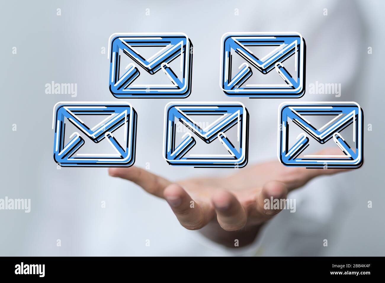 A Hand with an email icon 3d Stock Photo - Alamy