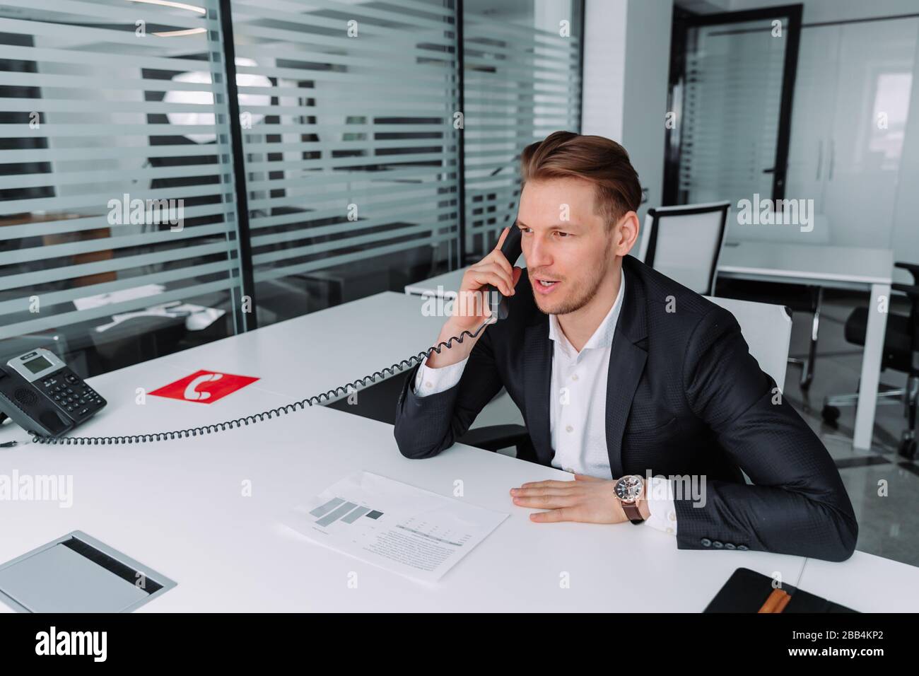 business man having conversation on Landline phone. Business man in ...