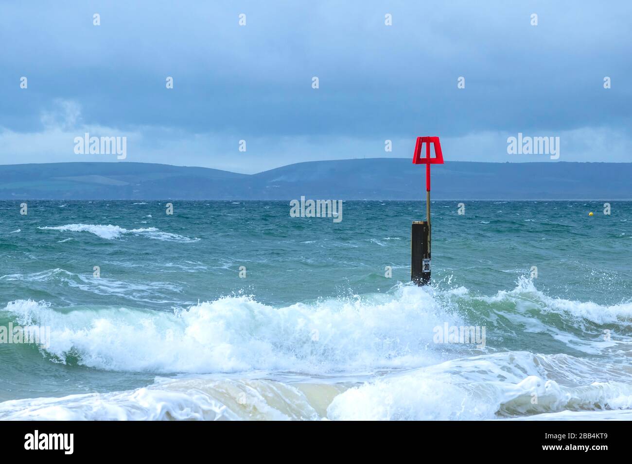 Windy groyne marker post at Bournemouth, Dorset, UK Stock Photo - Alamy