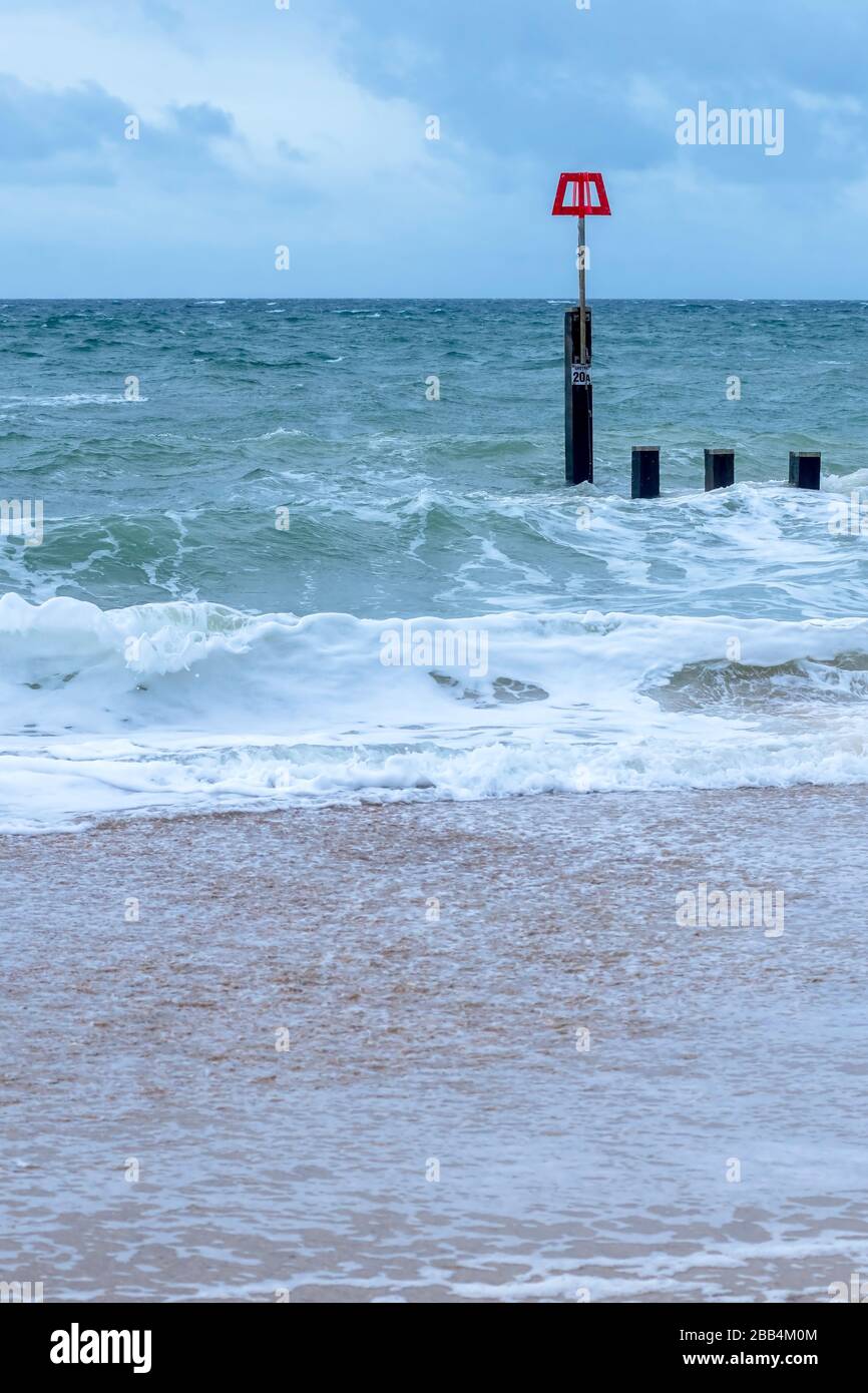 Windy groyne marker post at Bournemouth, Dorset, UK Stock Photo - Alamy