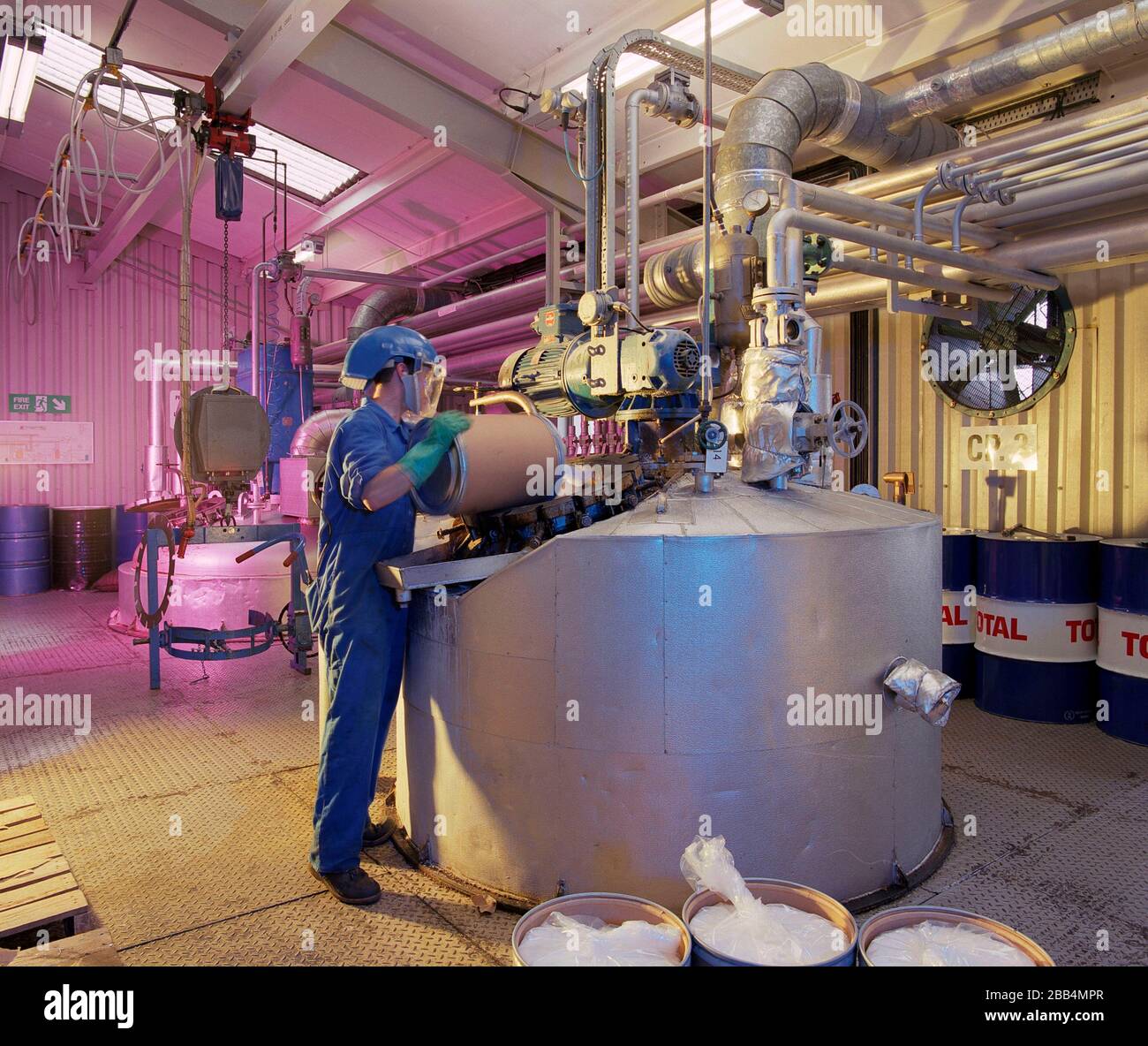 Workers in grease plant hi-res stock photography and images - Alamy