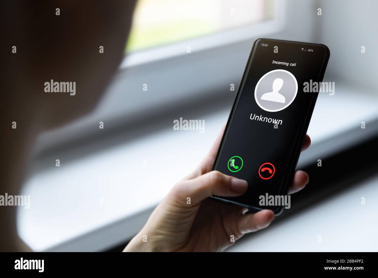 woman holding mobile phone with incoming call from unknown caller Stock ...