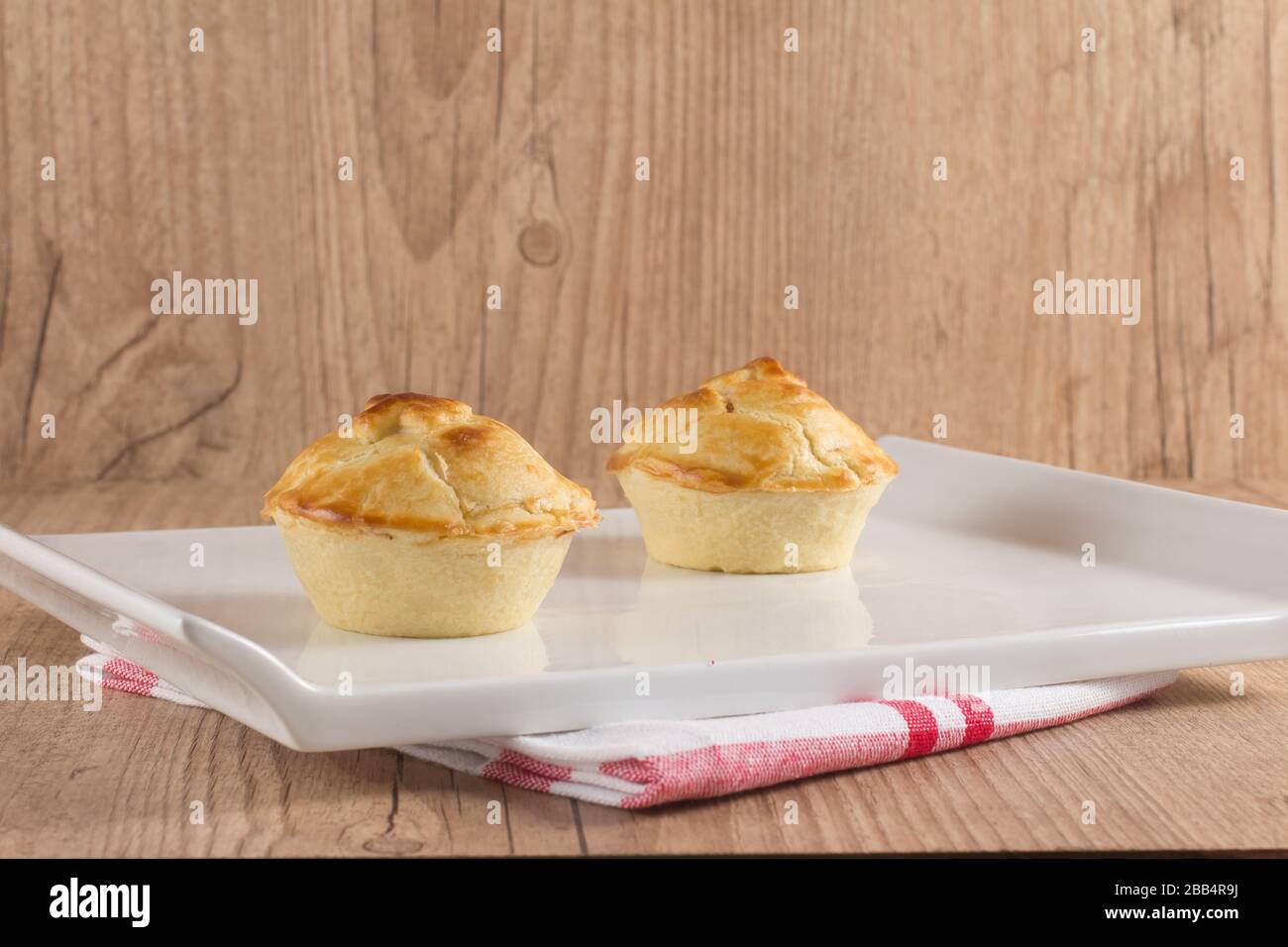 Traditional Brazilian Empada over a wooden table Stock Photo - Alamy