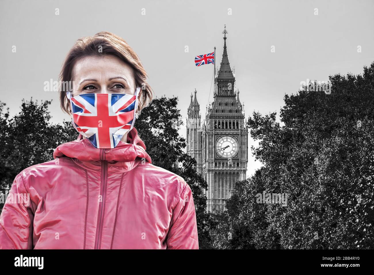 Woman wearing protection face mask with British flag against ...