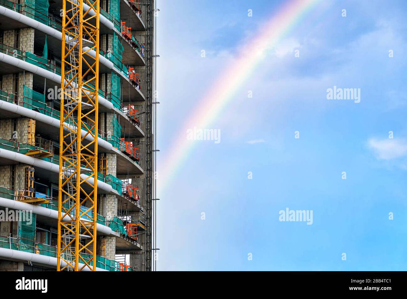 High-rise building under construction, with rainbow Stock Photo - Alamy