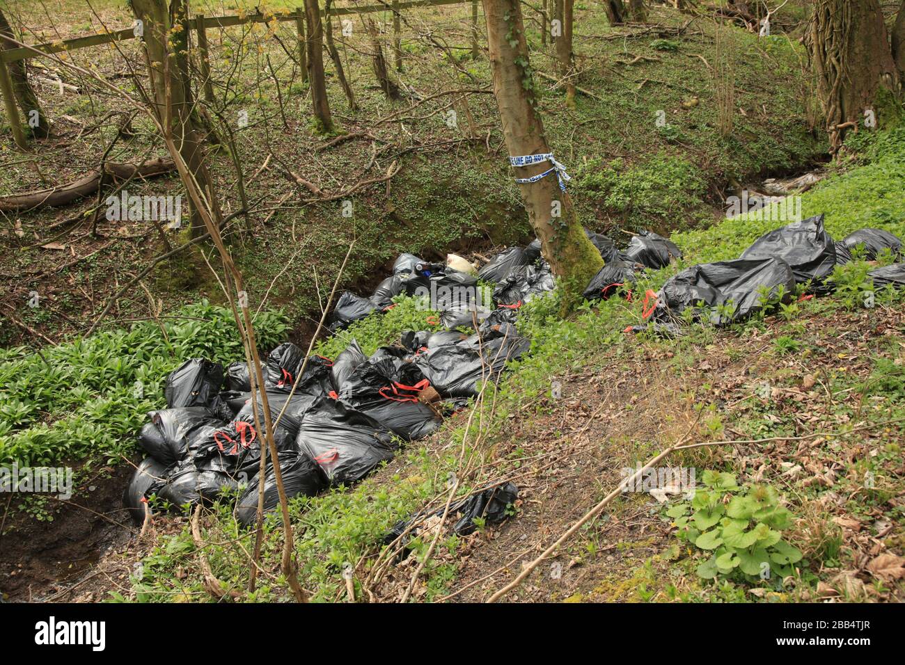 Fly tipping on a British country lane Stock Photo - Alamy