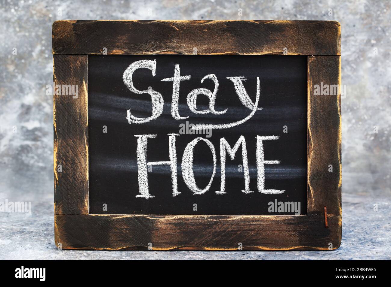 Social notice board with message stay at home Stock Photo - Alamy