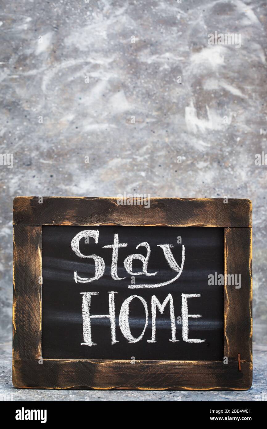 Social notice board with message stay at home Stock Photo - Alamy