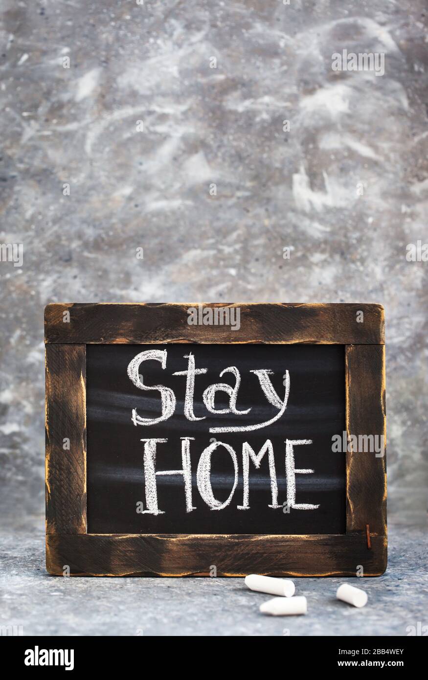 Social notice board with message stay at home Stock Photo - Alamy