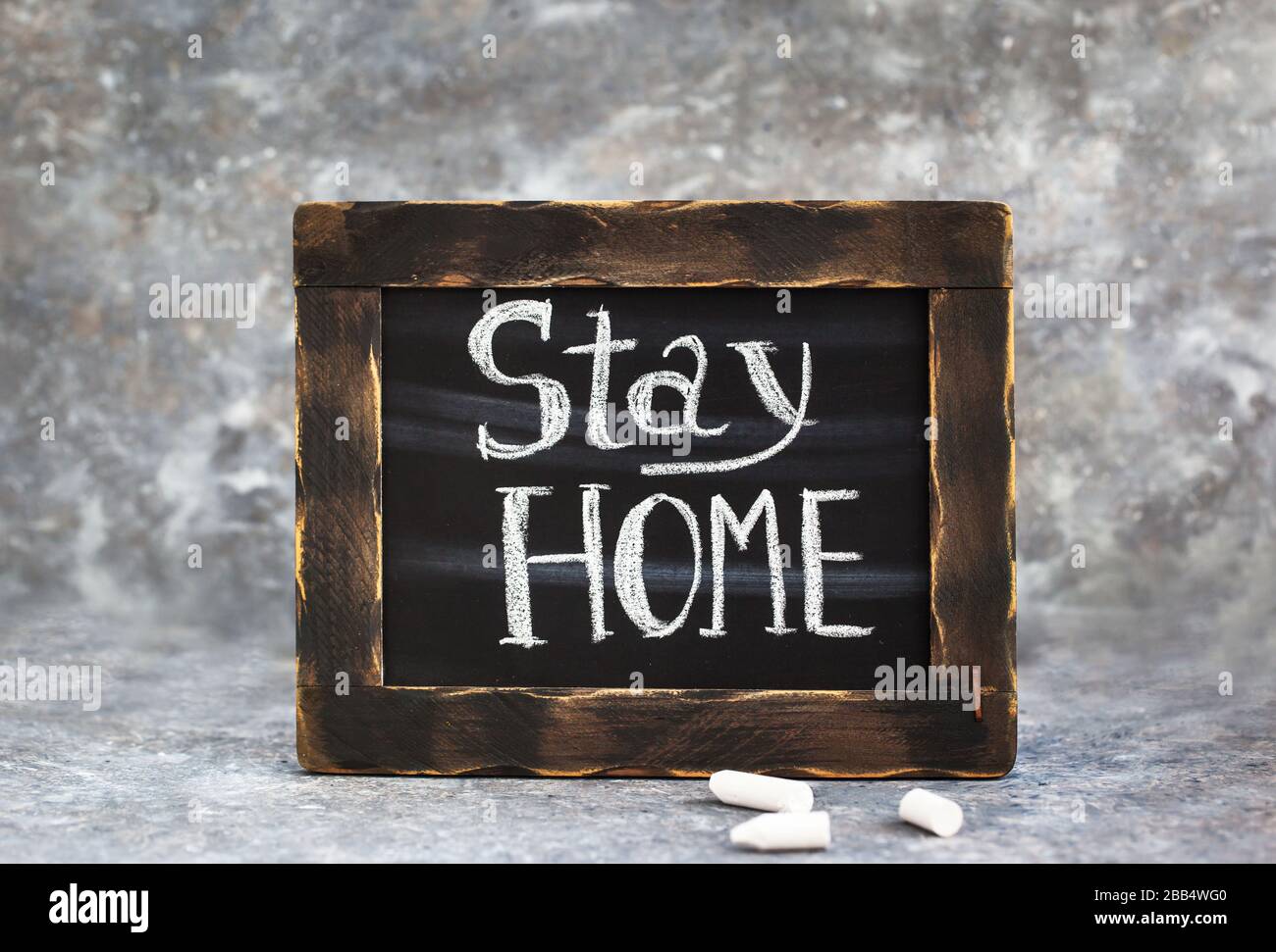 Social notice board with message stay at home Stock Photo - Alamy