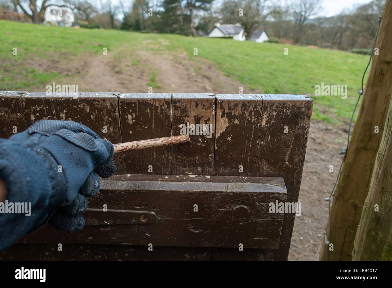 Using a stick to open gates hi-res stock photography and images - Alamy