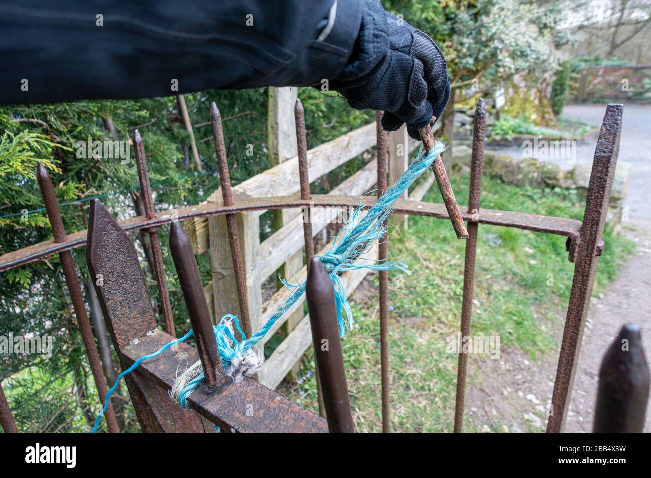 Using a stick to open gates hi-res stock photography and images - Alamy
