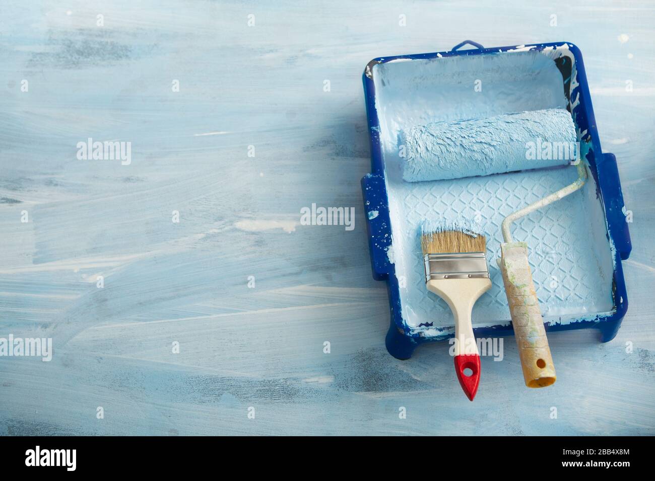 Tools for repair. Tray, roller and brush Stock Photo - Alamy