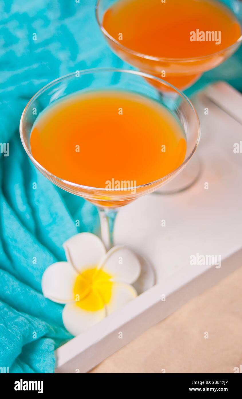Glasses of tropical exotic multifruit juice cocktail drink on the white ...