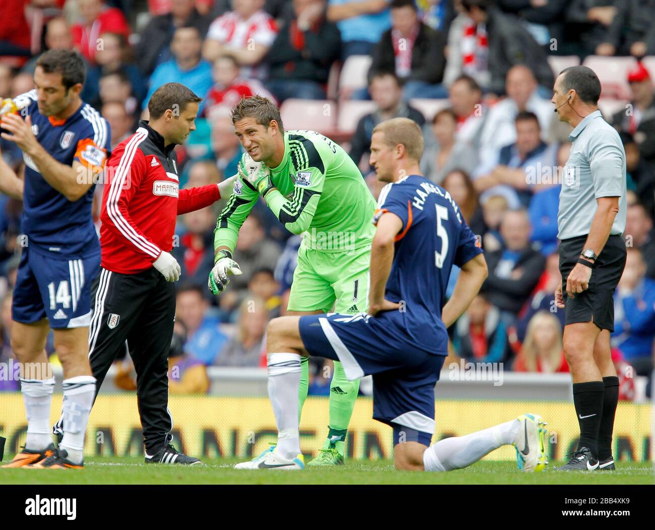 Fulham goalkeeper Maarten Stekelenburg winces in pain Stock Photo - Alamy