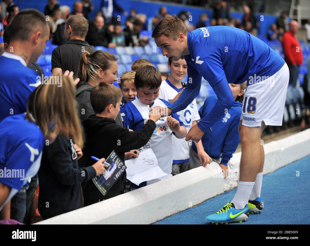 Birmingham City's Mitch Hancox (right) signs autographs for fans Stock ...