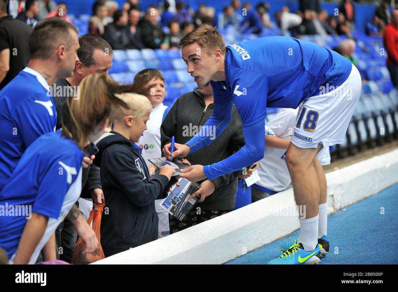 Birmingham City's Mitch Hancox (right) signs autographs for fans Stock ...