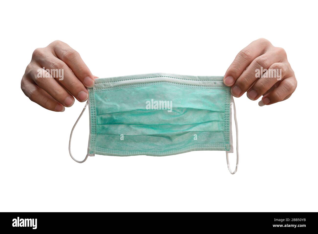 Hand holding medical mask isolated on white background. Object with ...