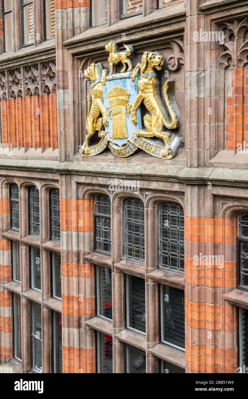 Coat of arms on HSBC bank building with dogs and sheaf of wheat ...