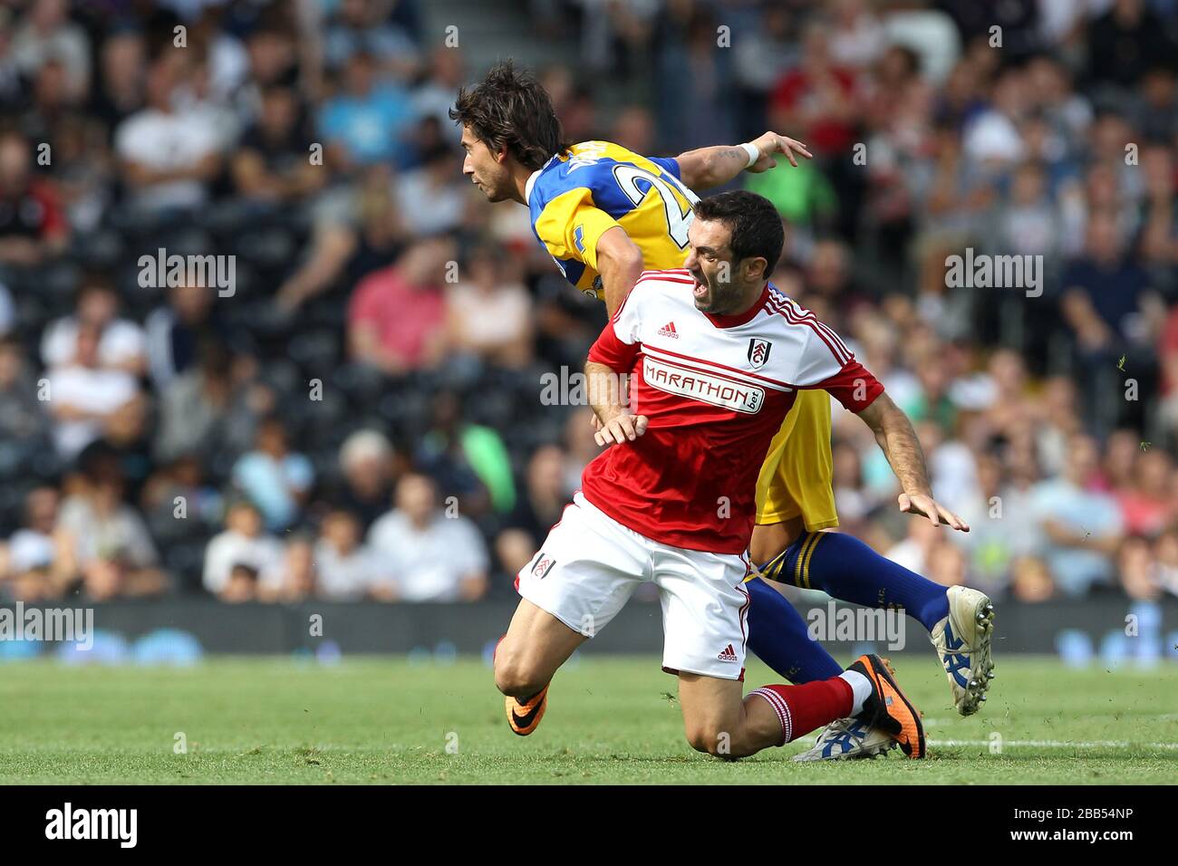 Fulham's Giorgos Karagounis (front) takes a tumble Stock Photo - Alamy