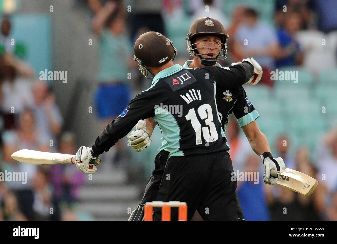 Surrey's Jon Lewis (right) and Gareth Batty (left) embrace after ...