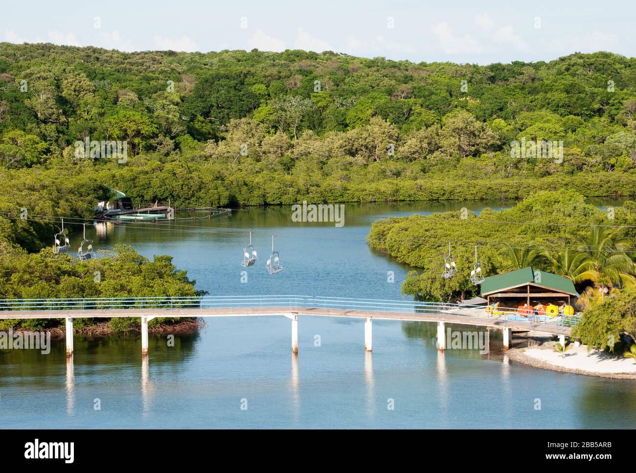 The pedestrian bridge and a cable transportation leads to Mahogany Bay ...