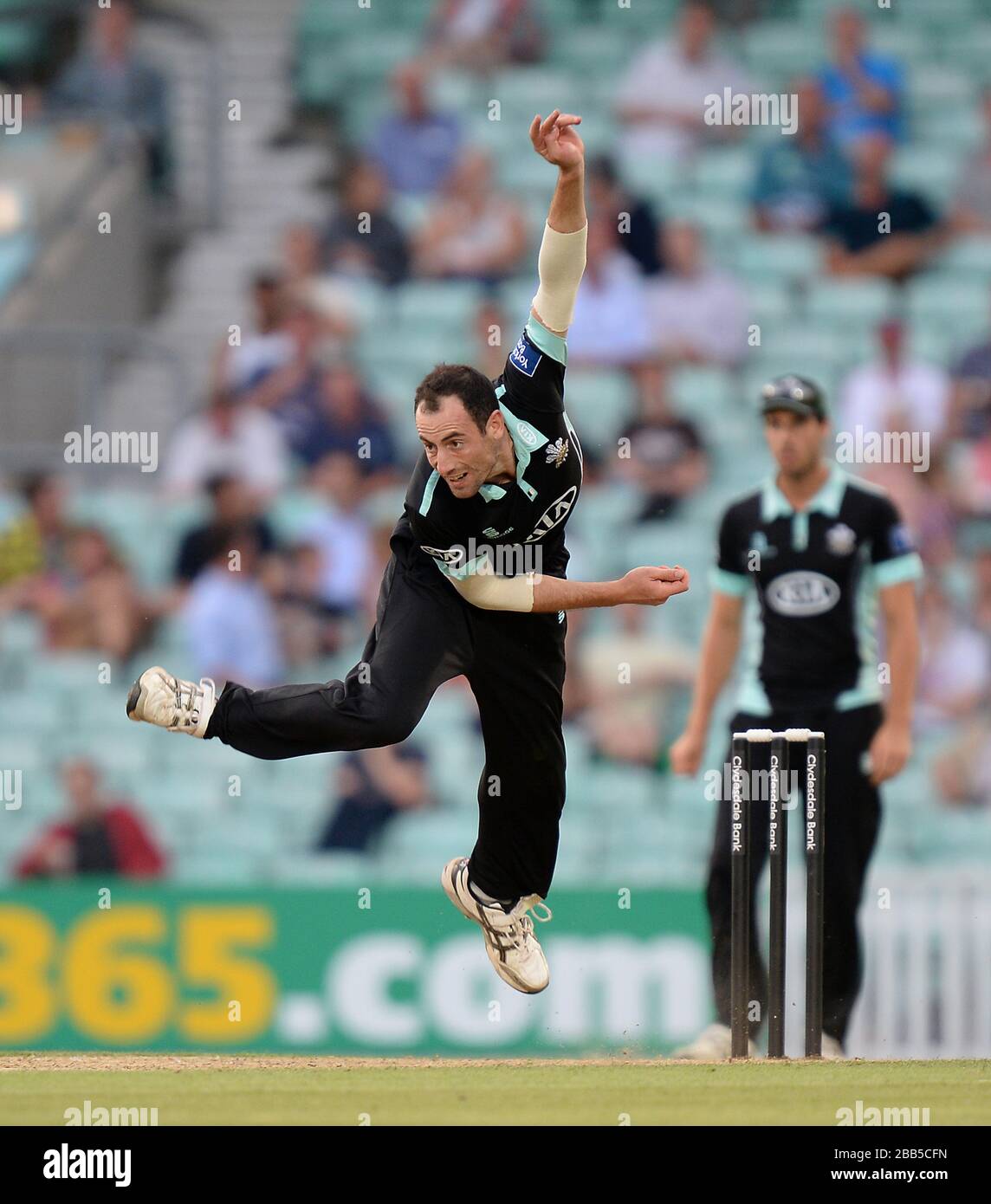 Surrey's Tim Linley bowls Stock Photo - Alamy