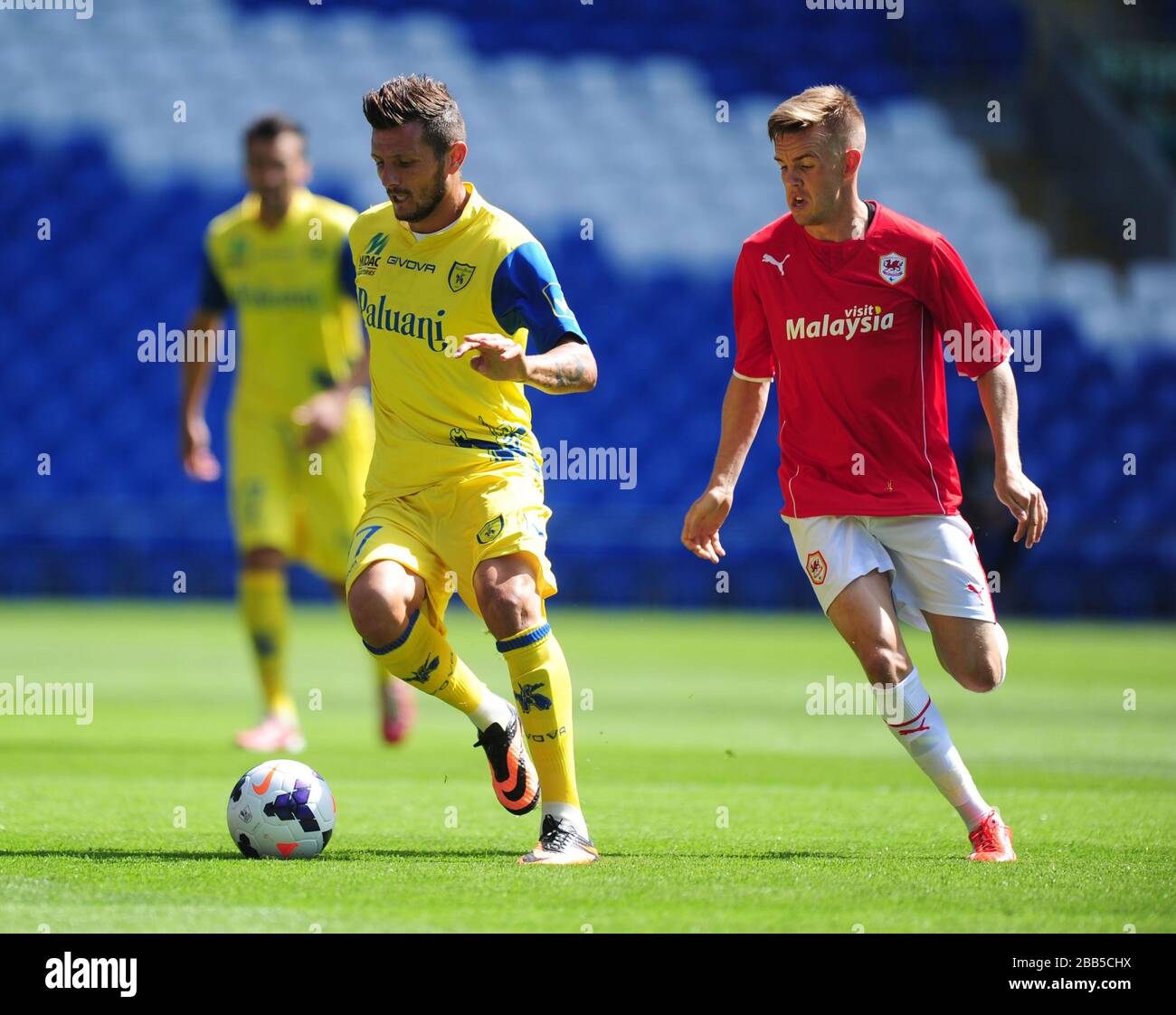 Cardiff City's Craig Noone and Chievo Verona's Cyril Thereau battle for ...